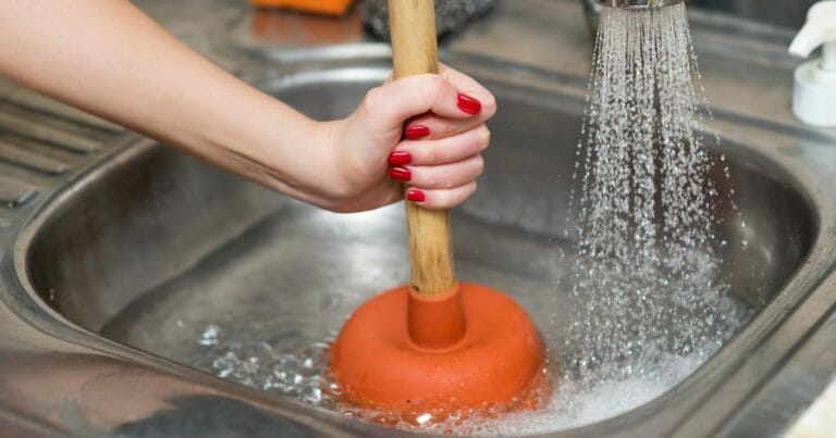 How to Unclog a Garbage Disposal With Standing Water